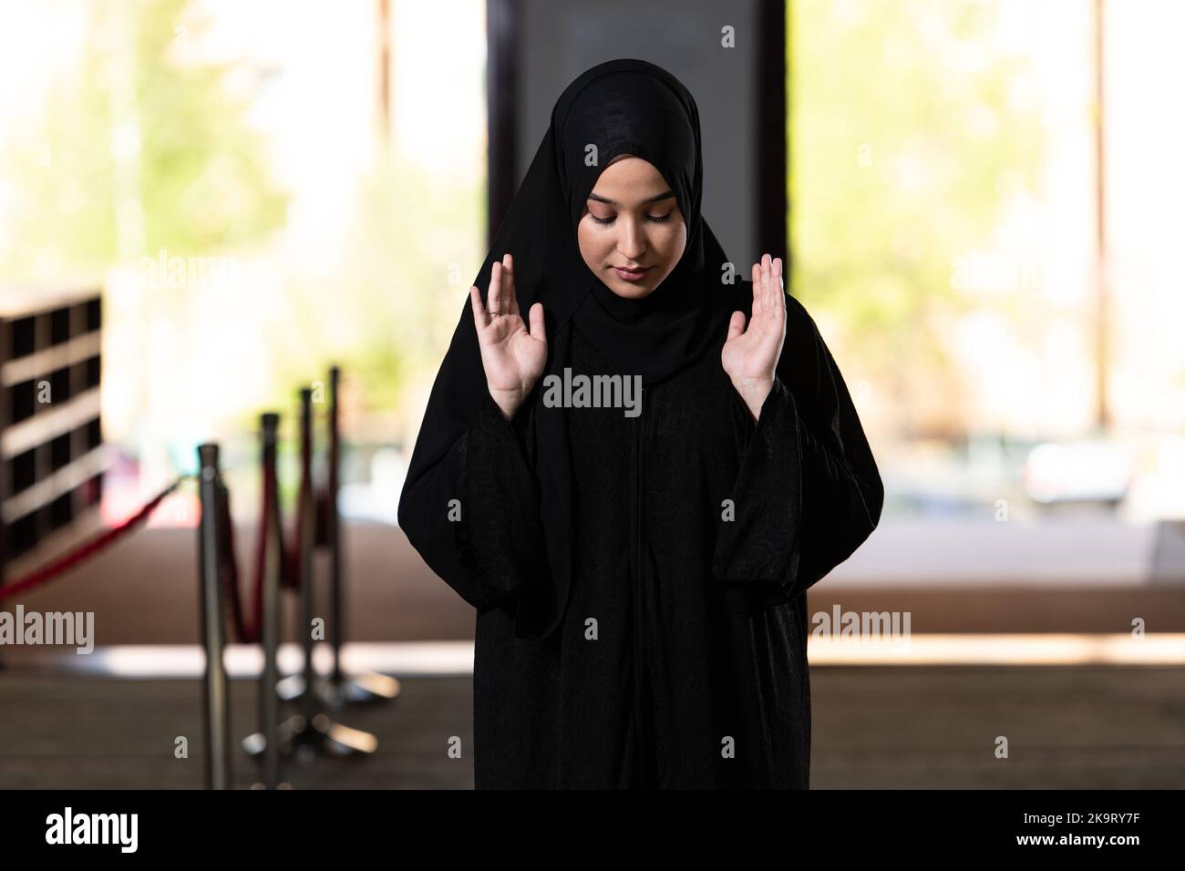 Muslim Woman in Beige Hijab and Traditional Clothes Praying for Allah ...