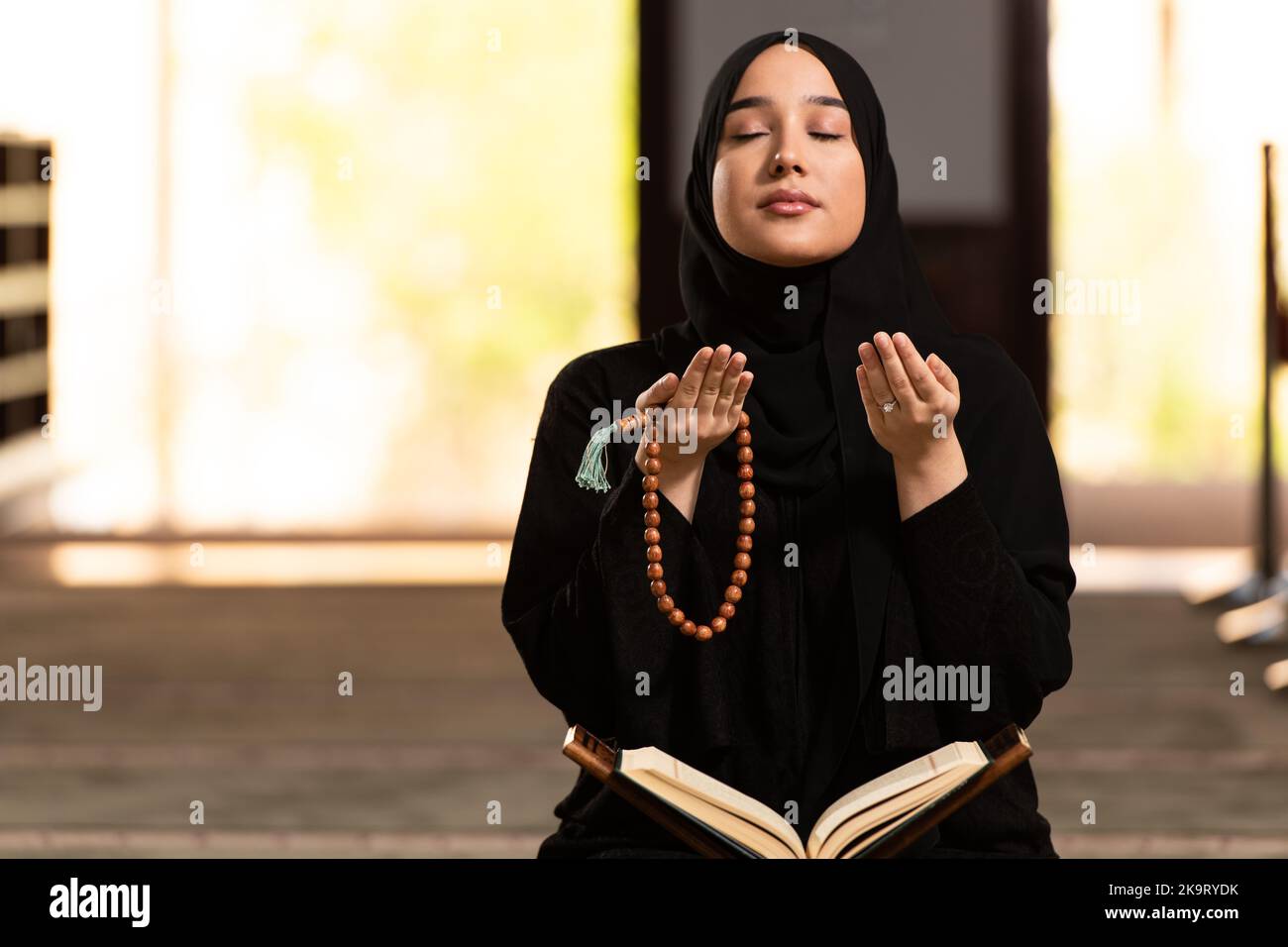 Humble Muslim Woman Holding Hands Up and Praying in Peace Stock Photo ...
