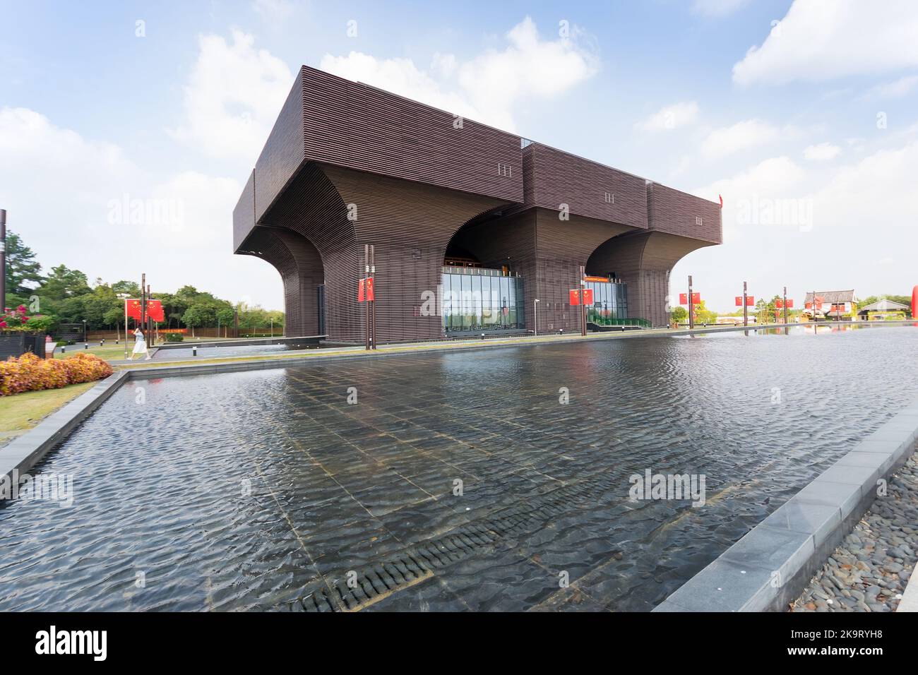original building in China opposite the water pool Stock Photo - Alamy