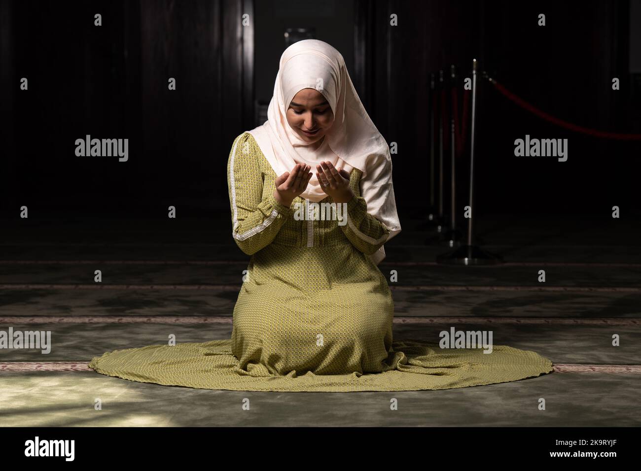Muslim Woman in Beige Hijab and Traditional Clothes Praying for Allah ...