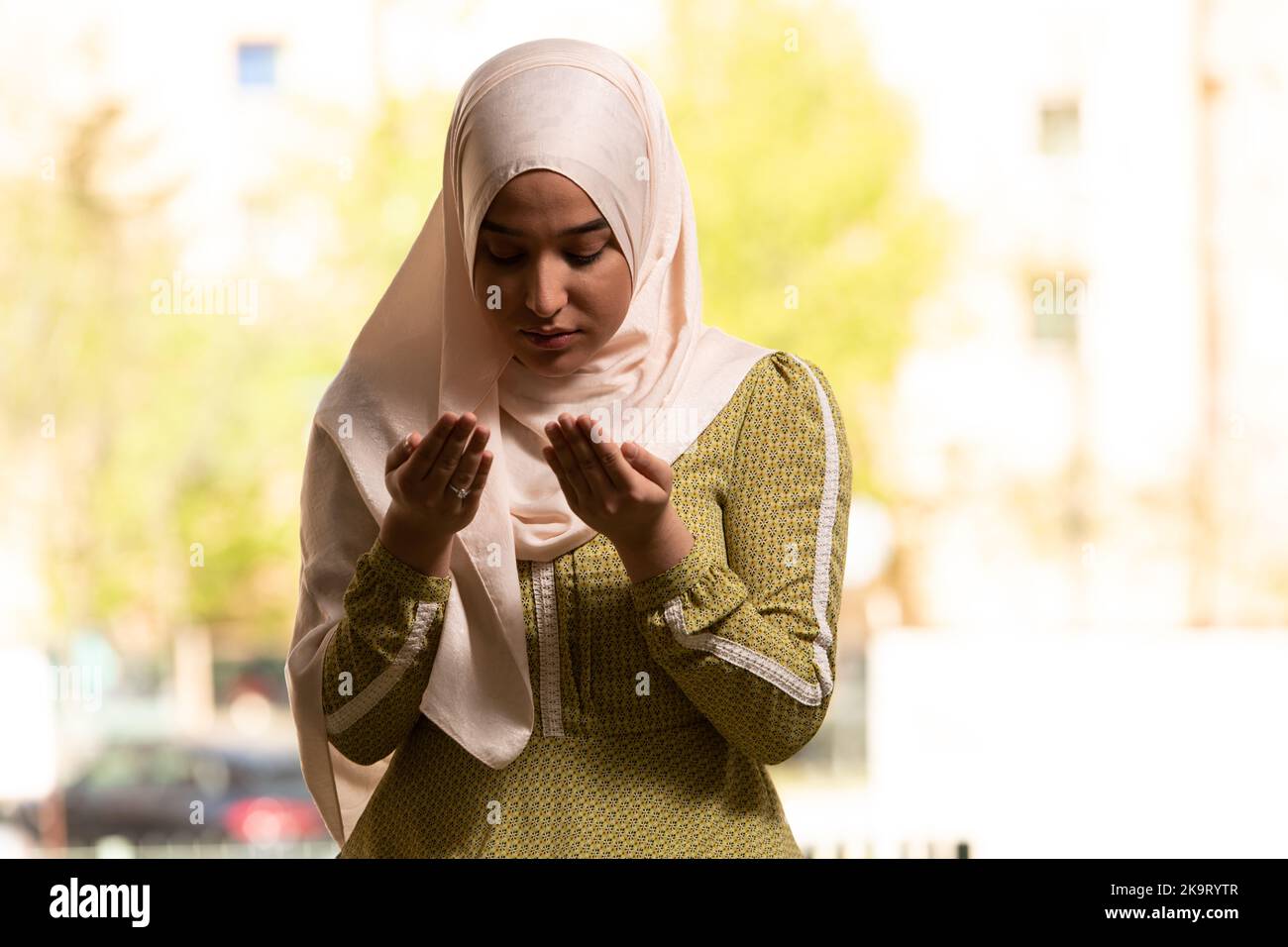 Humble Muslim Woman Holding Hands Up and Praying in Peace Stock Photo ...