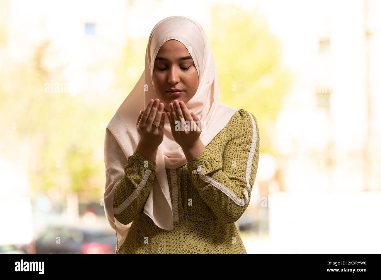 Humble Muslim Woman Holding Hands Up and Praying in Peace Stock Photo ...