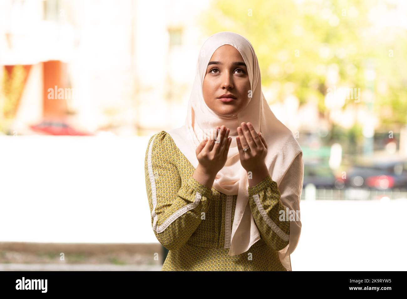 Humble Muslim Woman Holding Hands Up and Praying in Peace Stock Photo ...
