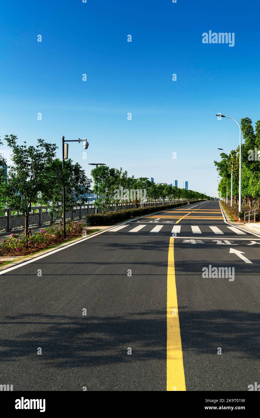 empty city road with skyline background Stock Photo - Alamy