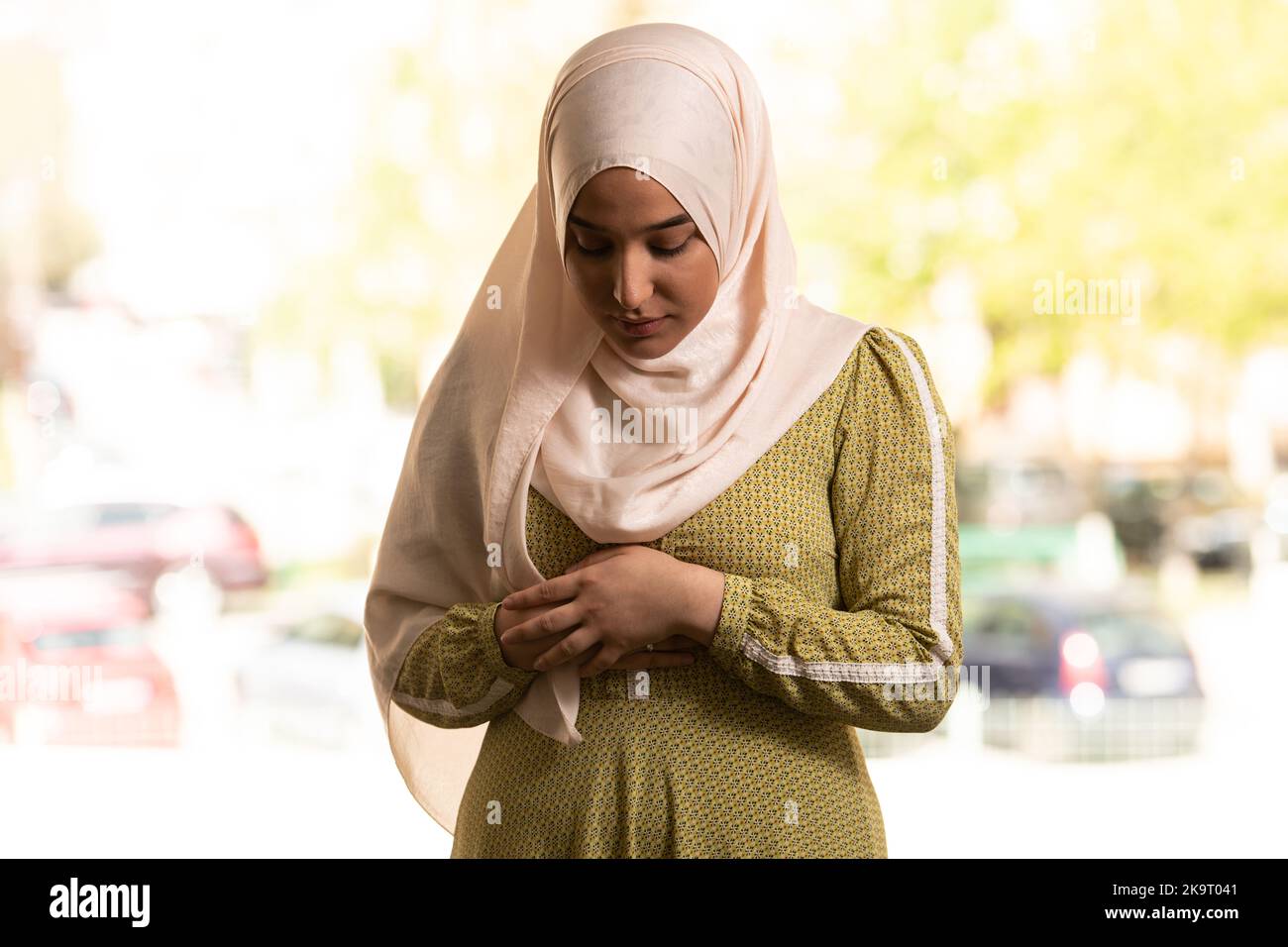 Muslim Woman in Beige Hijab and Traditional Clothes Praying for Allah ...