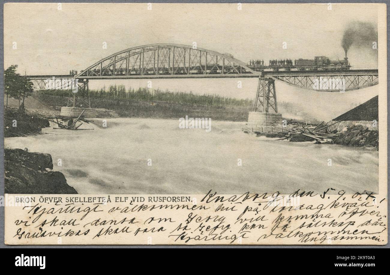 Bridge over the Skellefte River at Kusfors with freight trains in the ...