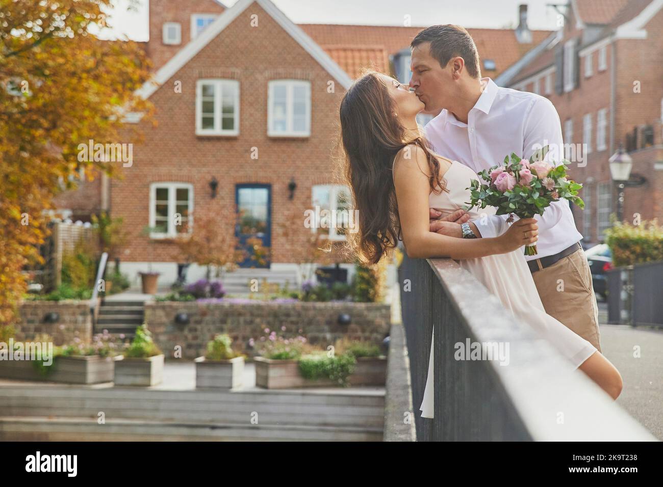Ribe, Denmark, October,2022: couple in love walking in the autumn city ...