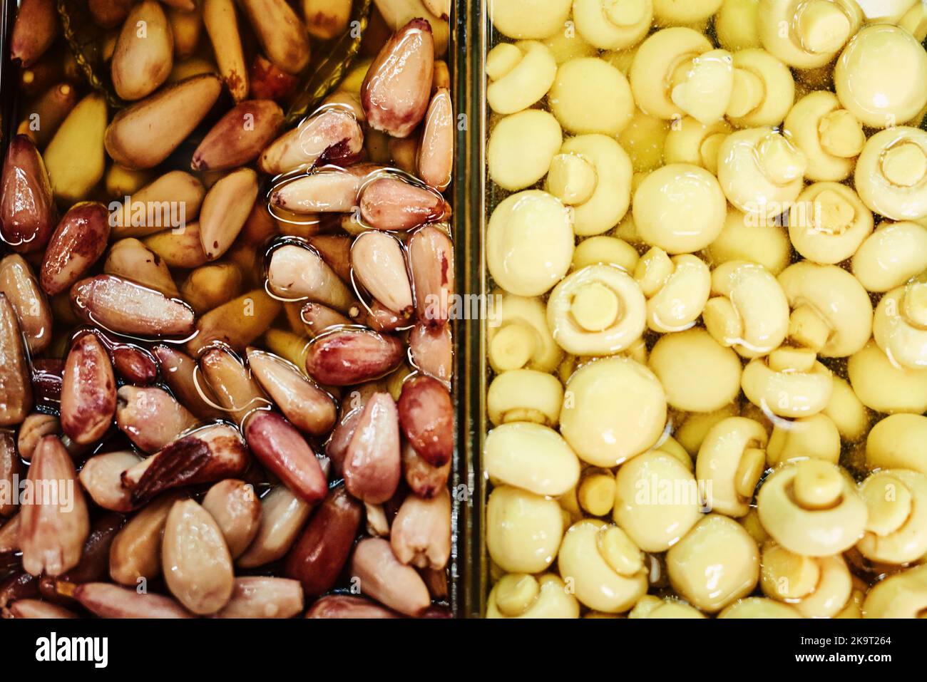 Theres two sides to a story. mushrooms and pine nuts displayed next to ...