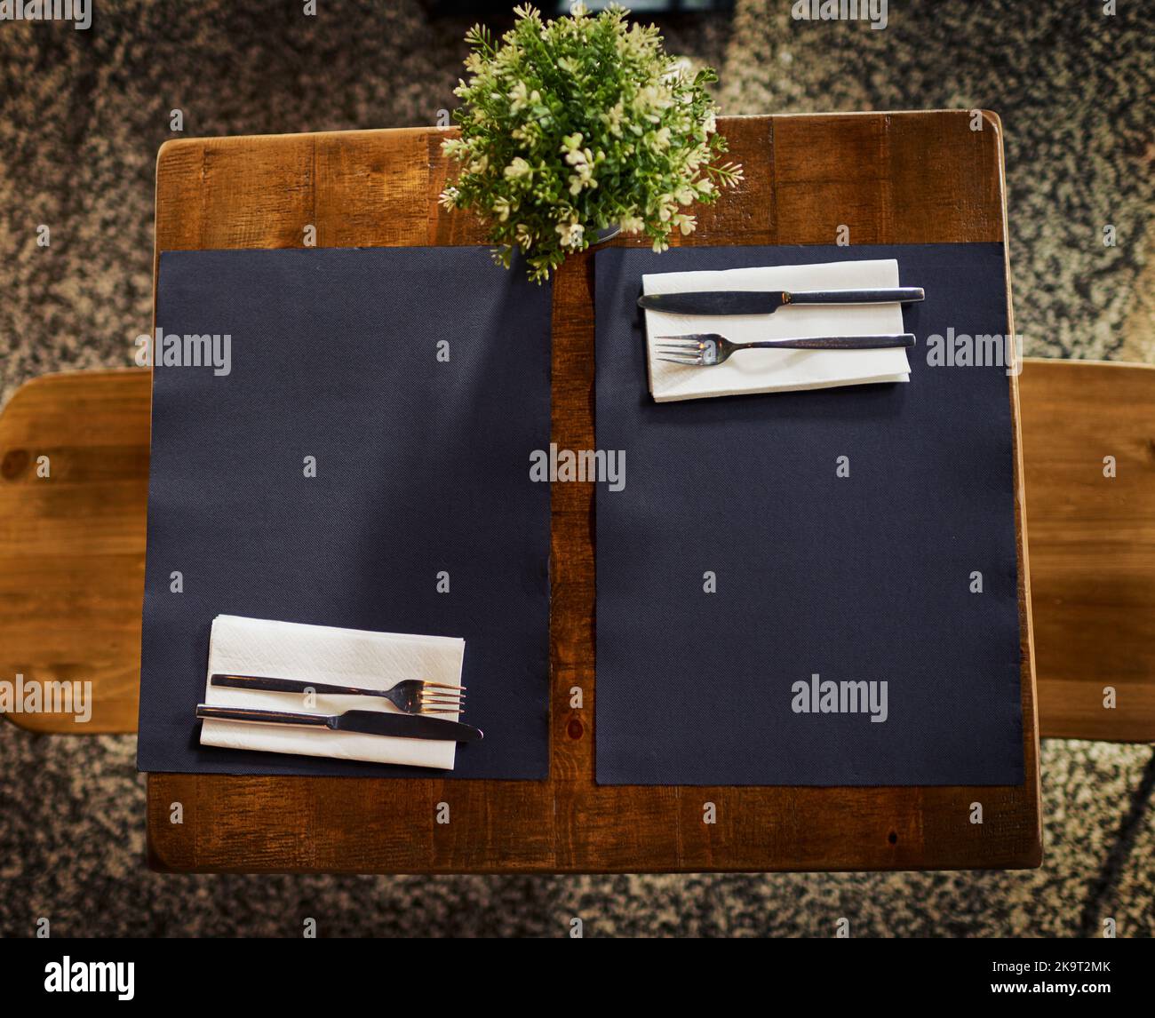 Would you like a table for two. High angle shot of and neatly set empty ...