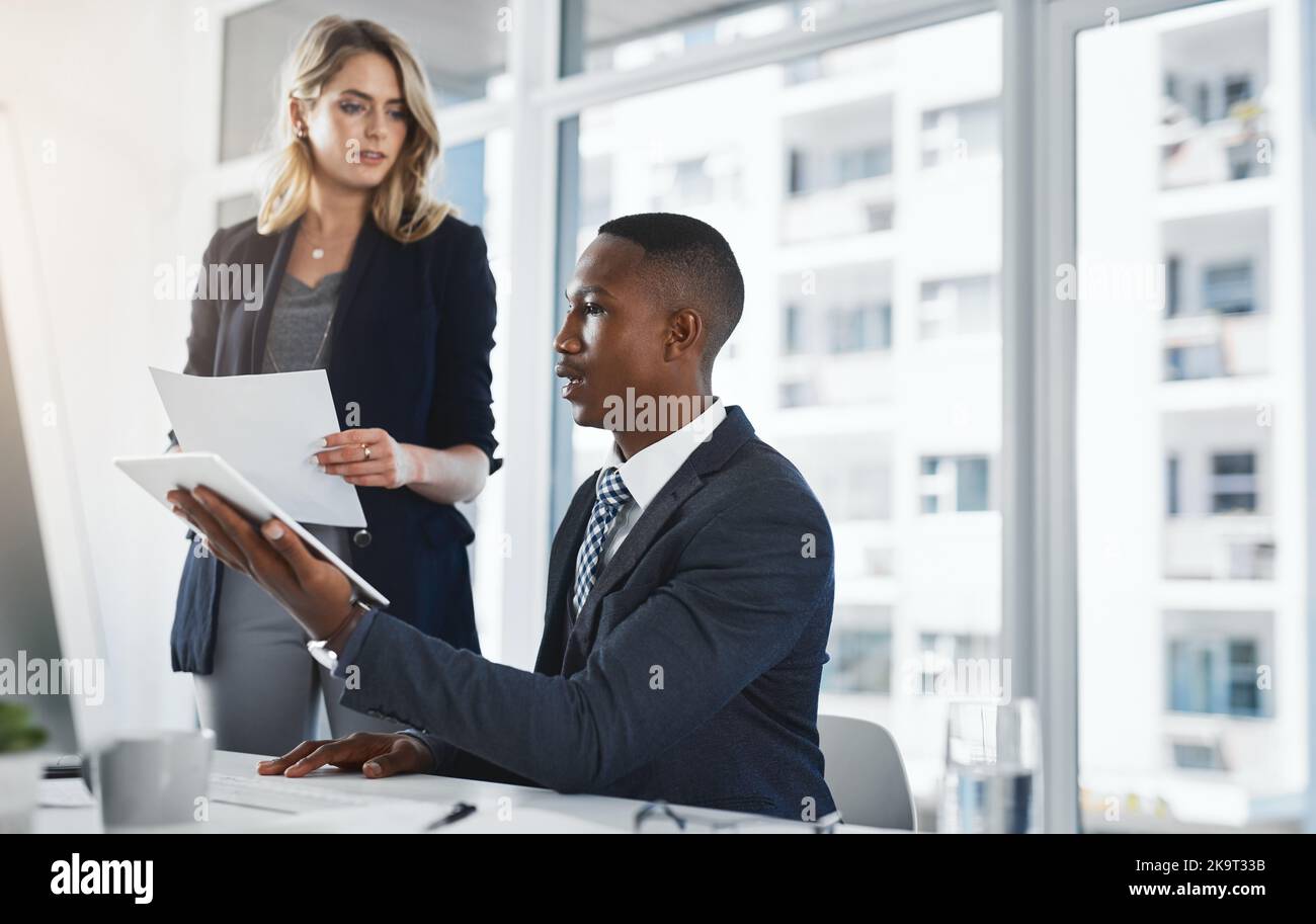 Success doesnt come without proper planning. two businesspeople working ...