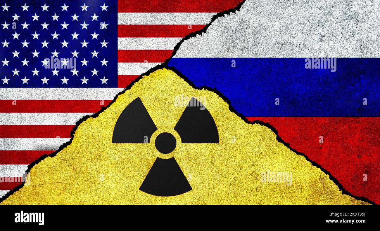 Flags of USA, Russia and Nuclear symbol together on a textured wall ...