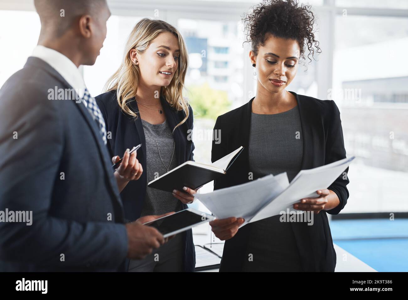 Proposing new plans to each other. a group of businesspeople going ...