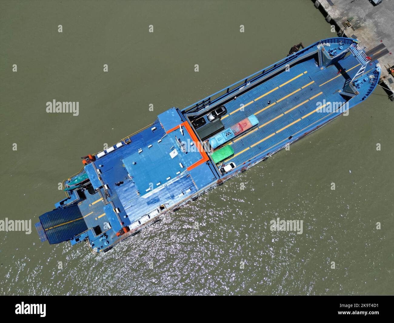 RoRo( roll-on roll-off) ferry docking at the jetty waiting for cars to ...