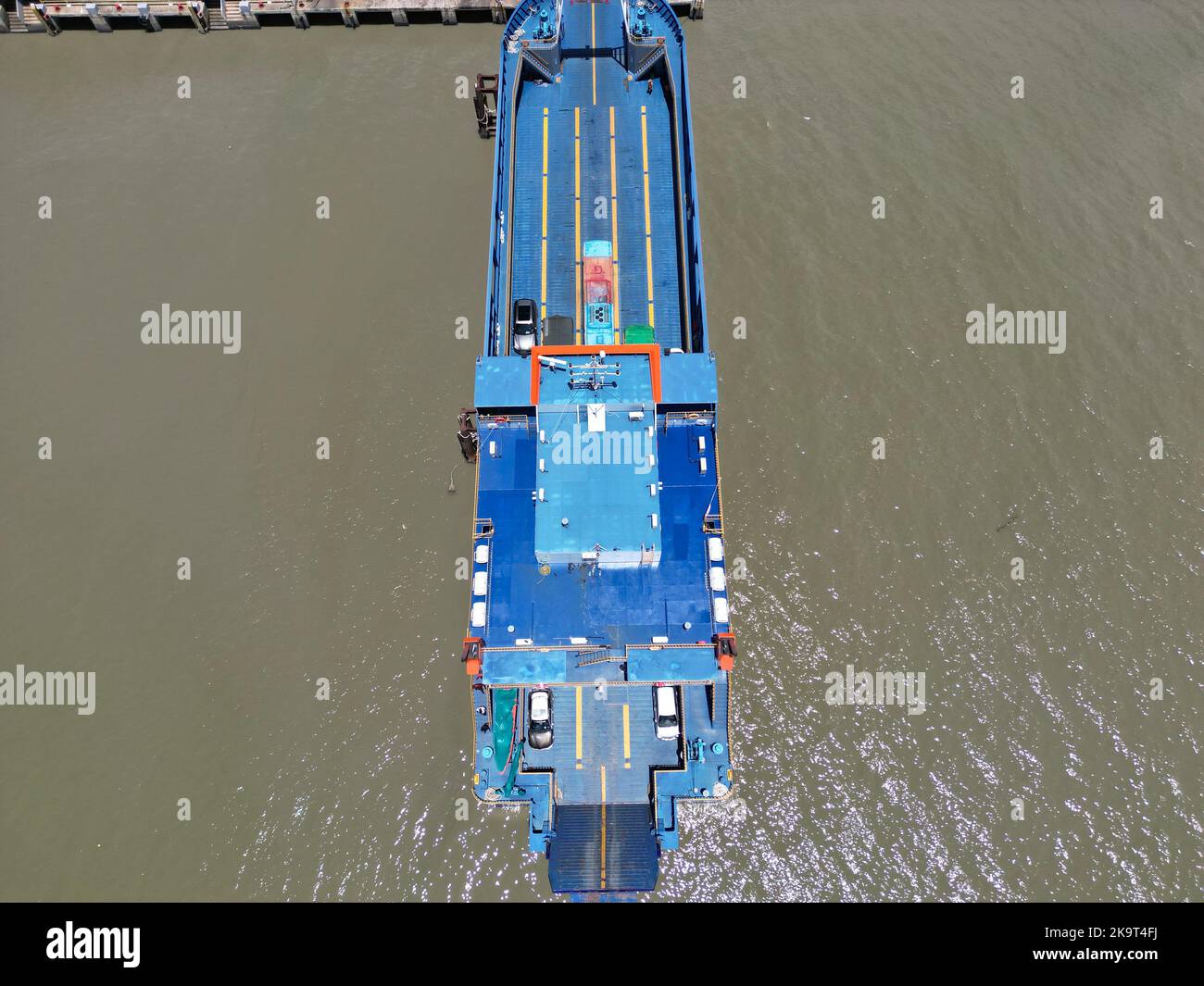 RoRo( roll-on roll-off) ferry docking at the jetty waiting for cars to ...