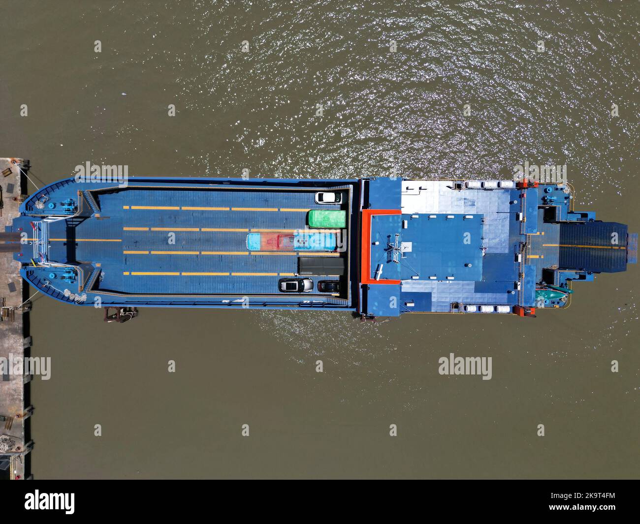 RoRo( roll-on roll-off) ferry docking at the jetty waiting for cars to ...