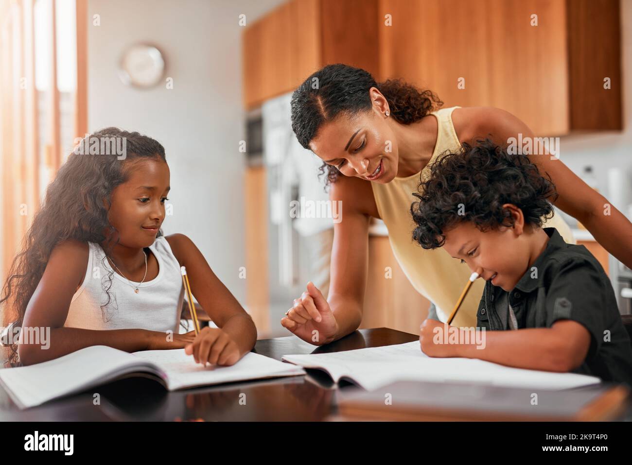 Theyre just as clever as their mom. a dad helping his children with ...