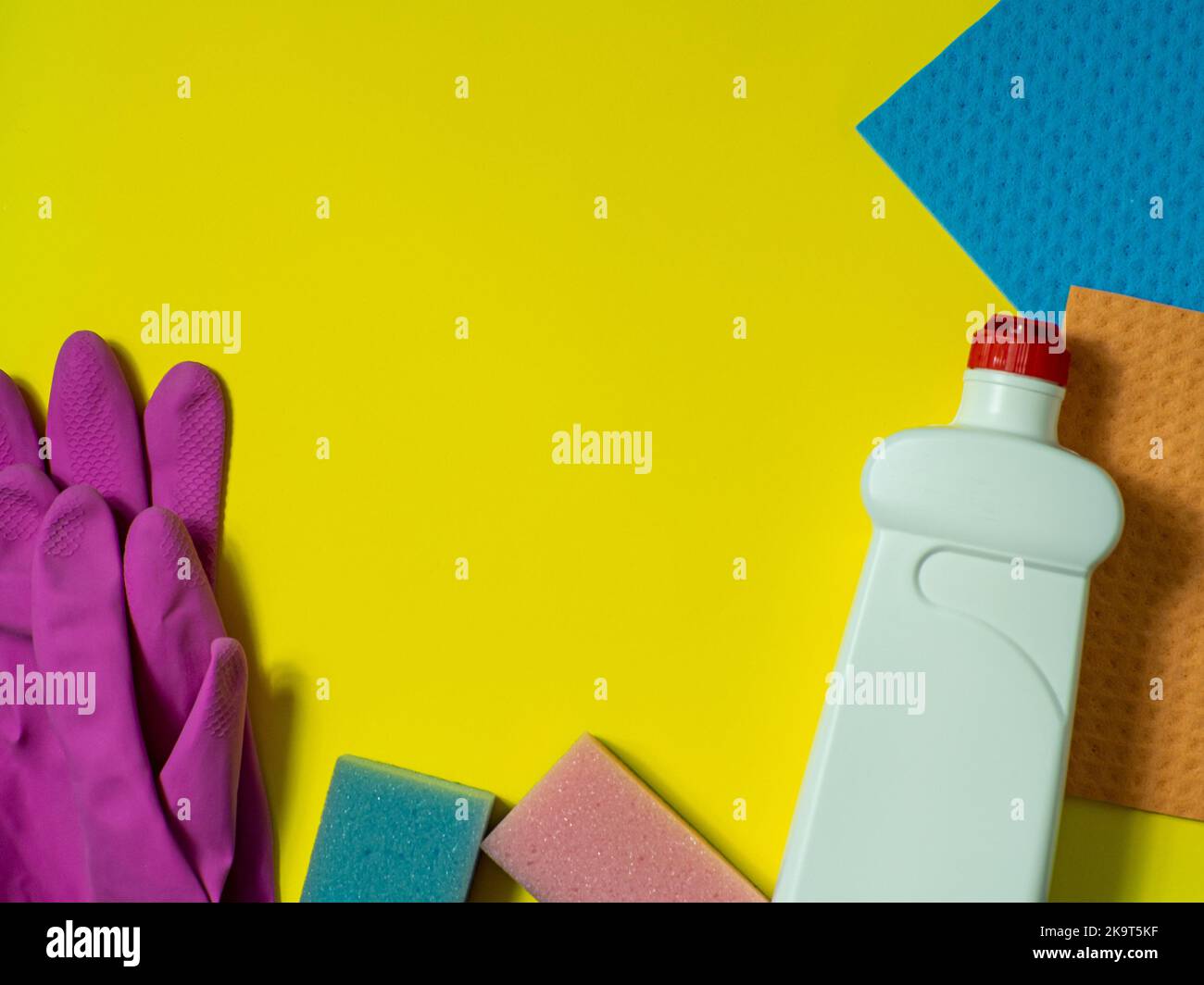 cleaning stuff on yellow background Stock Photo - Alamy