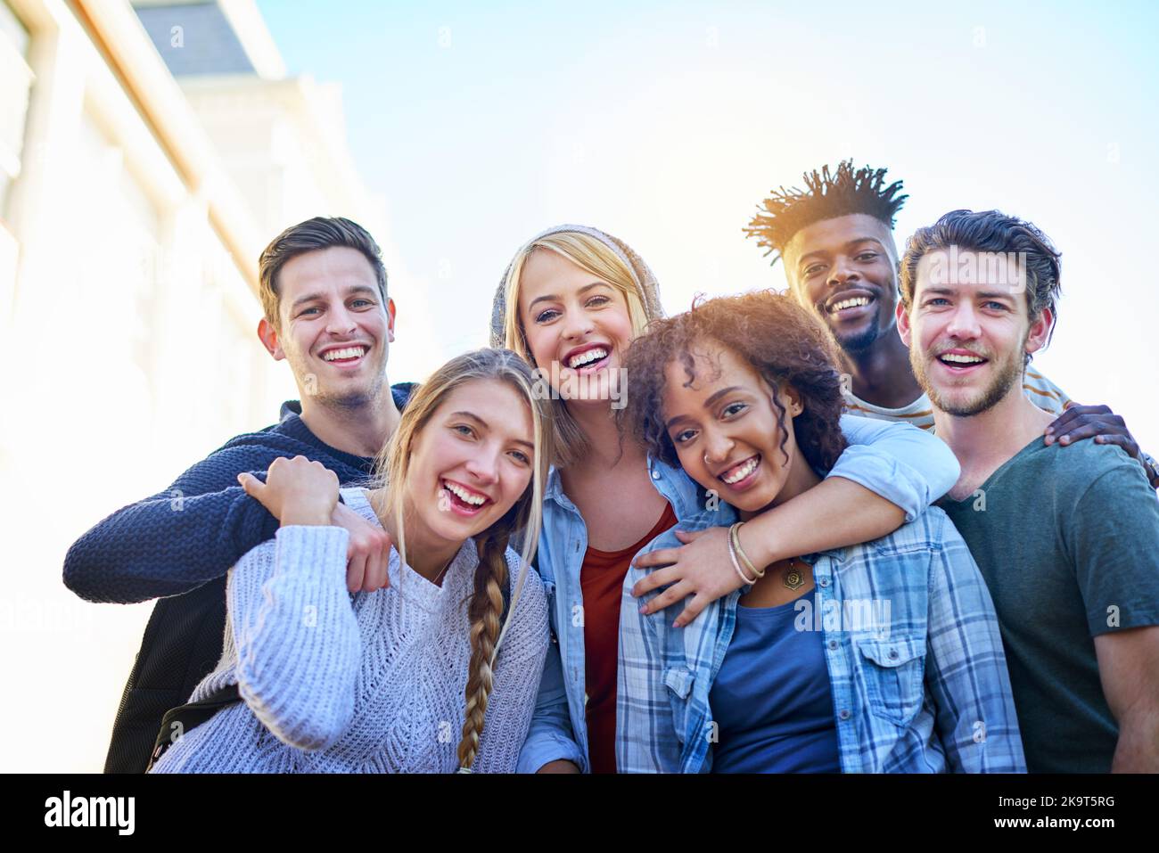 The college crew. Portrait of a group of diverse students hanging out ...
