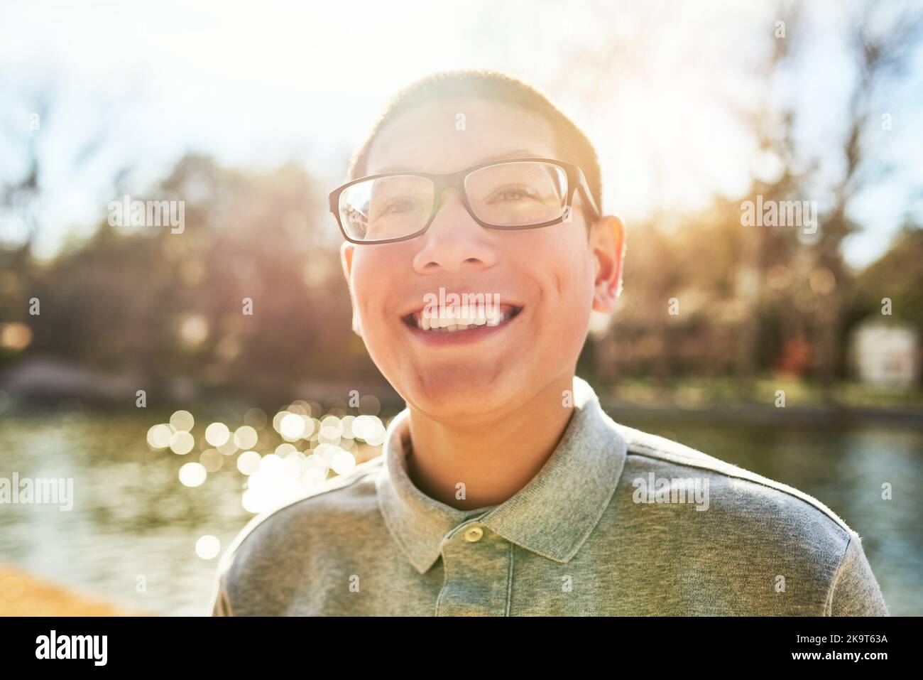 Hes always happy to be outdoors. Portrait of a teenage boy standing ...