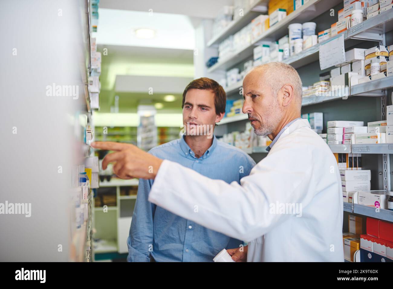 Have you tried this. a handsome mature male pharmacist helping a ...