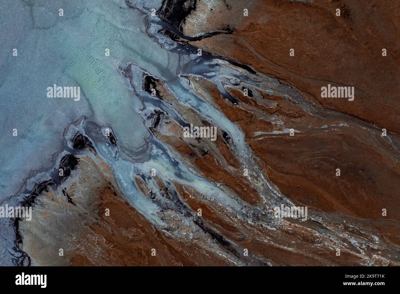 Colorful aerial ground texture with errosion and polution. red mud ...