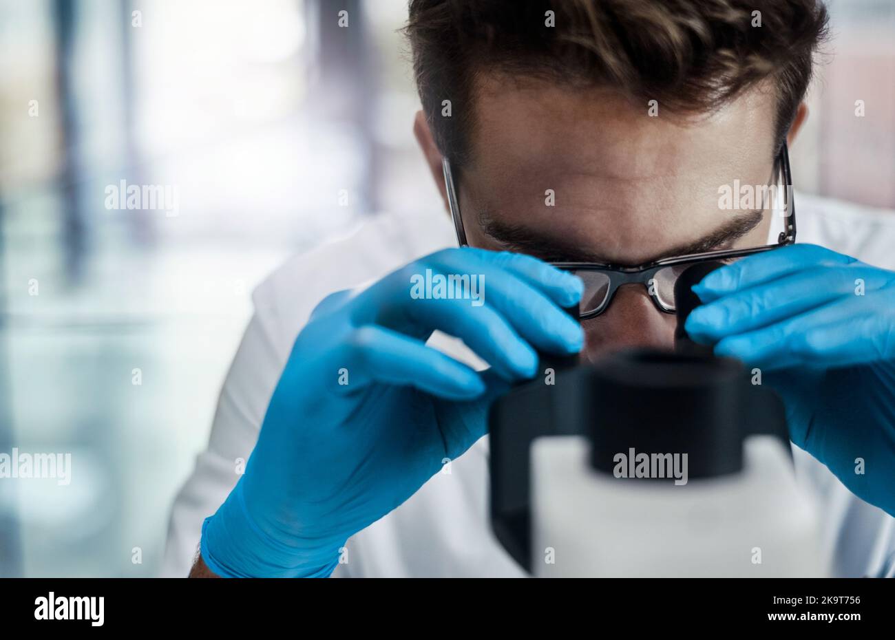 Great discoveries are made everyday. a young male scientist working in ...