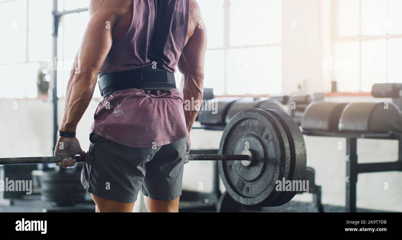 Closeup muscular young man lifting hi-res stock photography and images ...