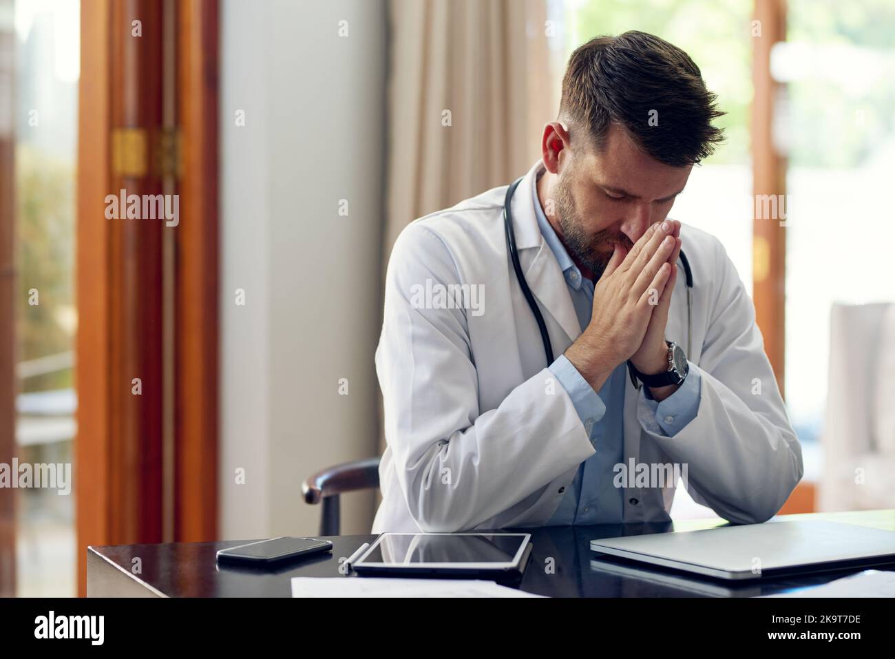 Praying and working hi-res stock photography and images - Alamy