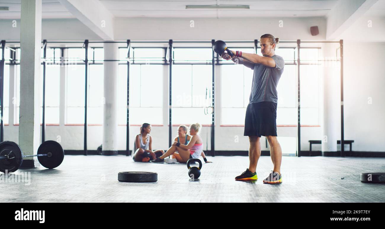 Your only competition is you to get fit. a young man working out with ...