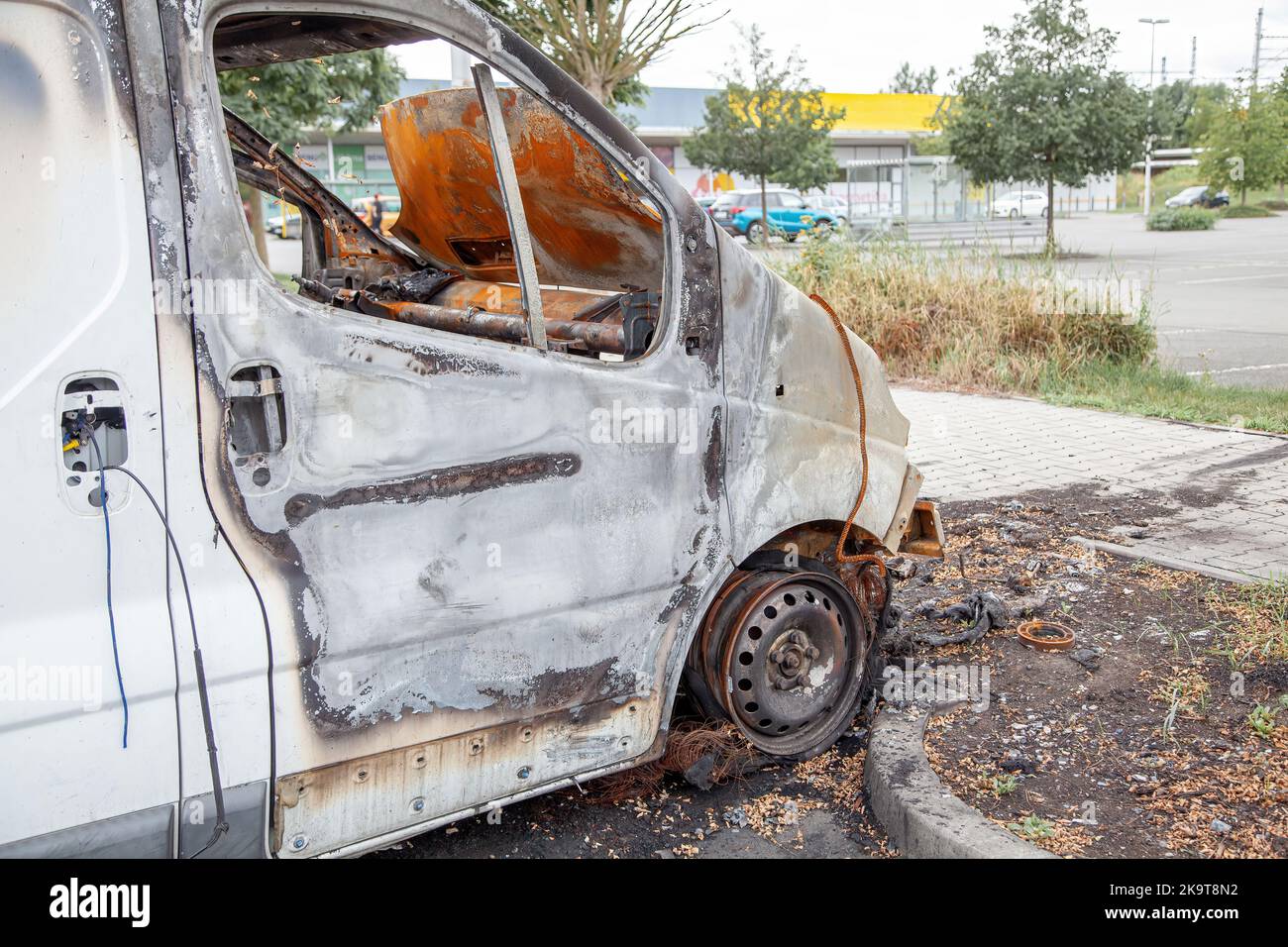Minibus after a fire, burnt body and interior of the car. Burnt rusty ...