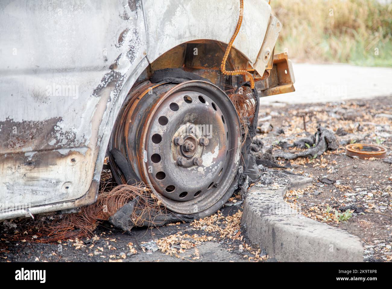 Minibus after a fire, burnt body and interior of the car. Burnt rusty ...