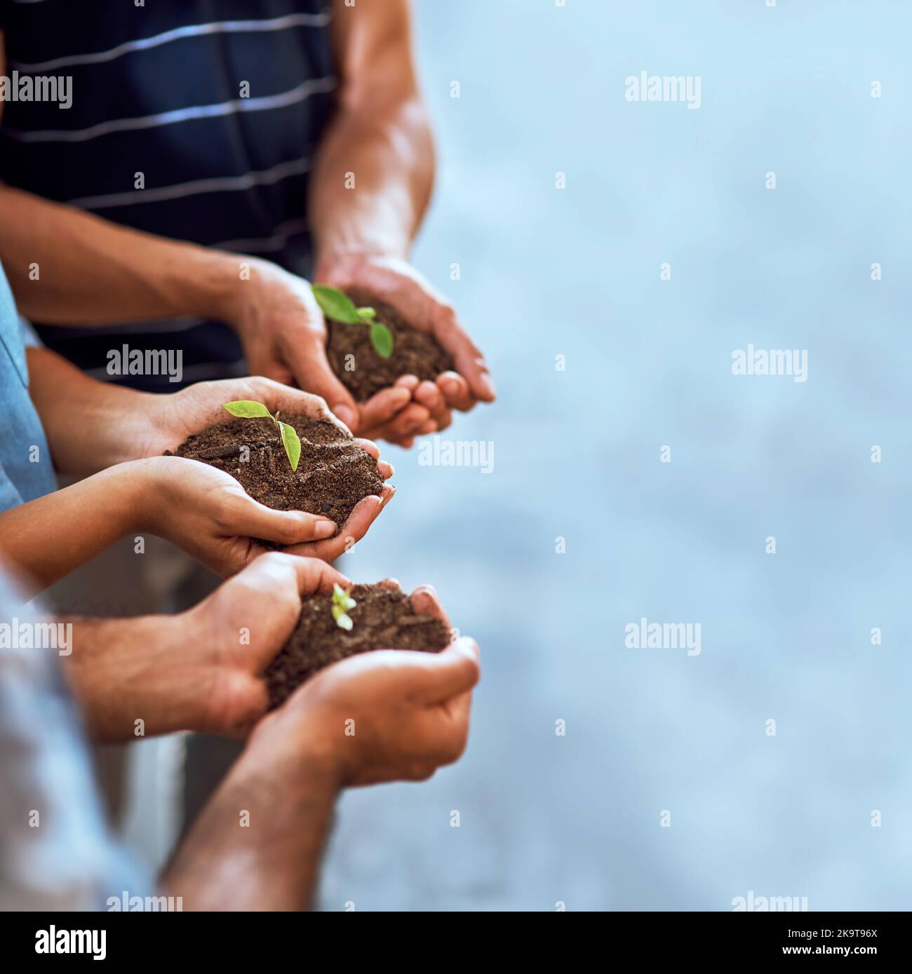 Growth lies in each of our hands. Closeup shot of a group of people ...