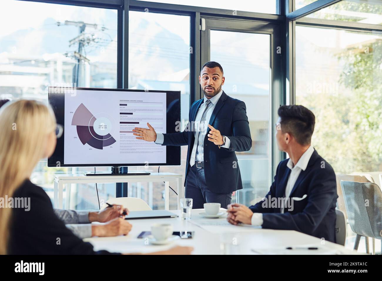 Lets talk consumer expansion. a young businessman delivering a ...