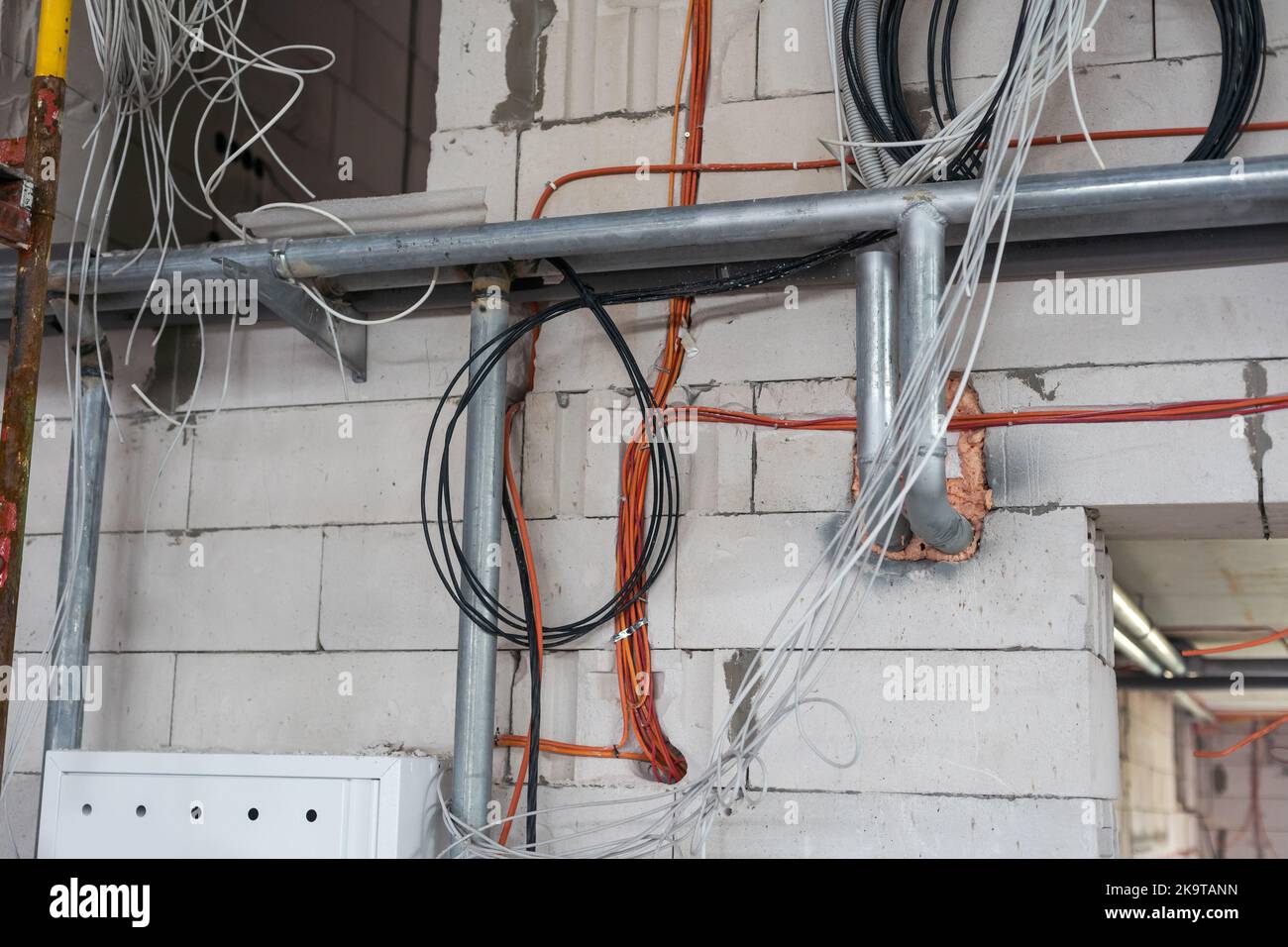 Electrical wiring work at a construction site. Wire extension Stock ...