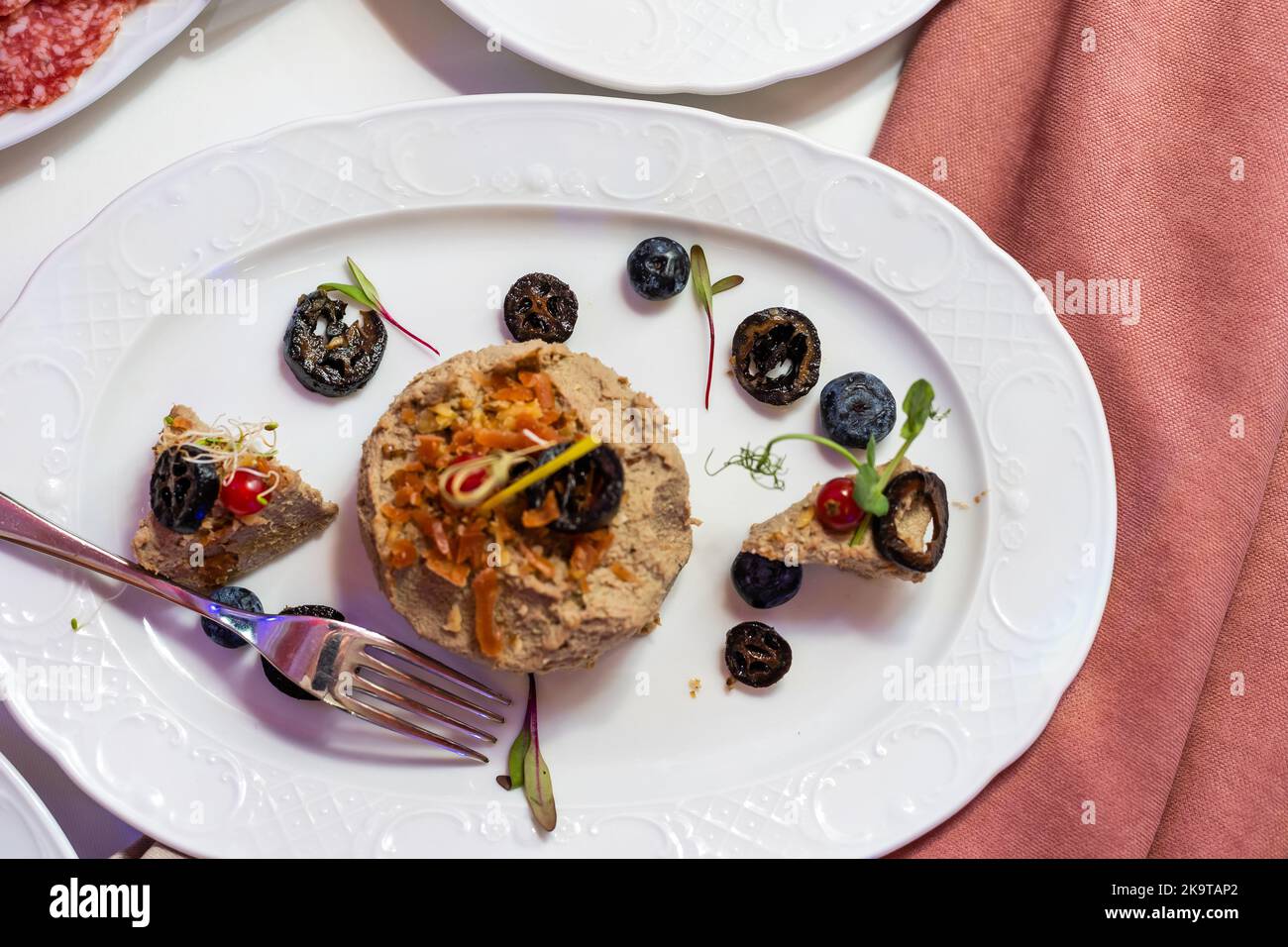 Banquet buffet food. Pomegranate salad with stuffed profiteroles and ...