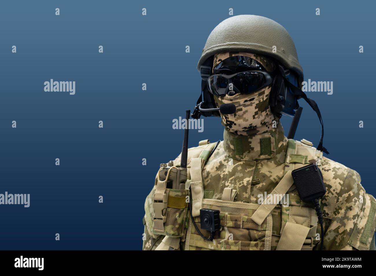 Elite member of Army rangers in helmet and dark glasses. Studio shot ...