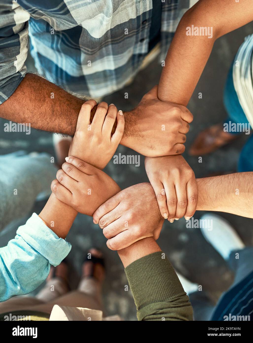 Hand together we can do this no matter what. High angle shot of a young ...