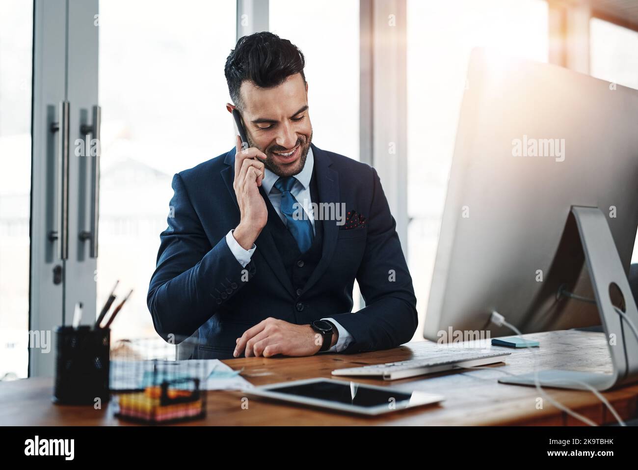 Contacting potential clients is part of his job. a handsome male ...