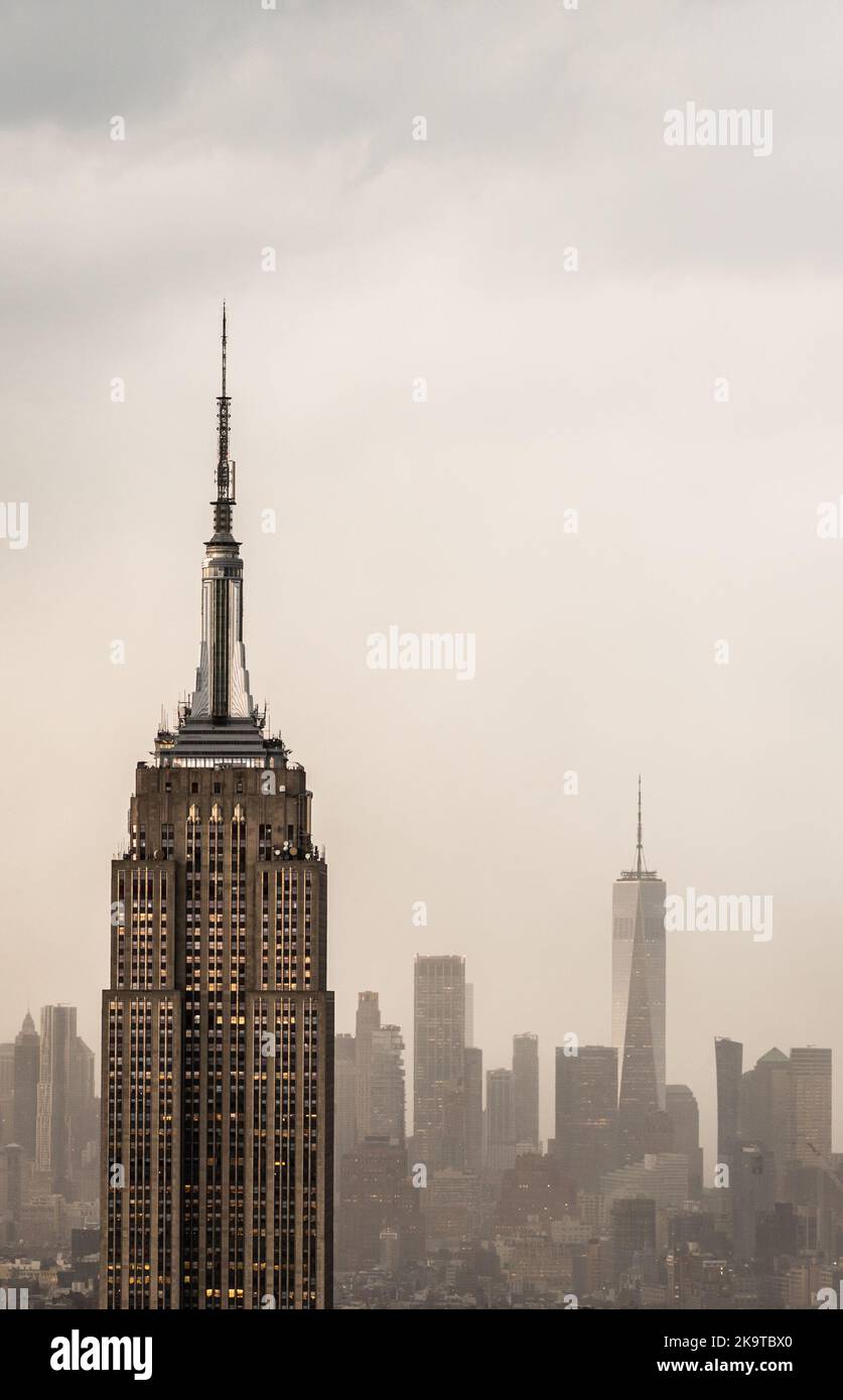 Futuristic view of a skyscraper tower in a light haze of fog or smog ...