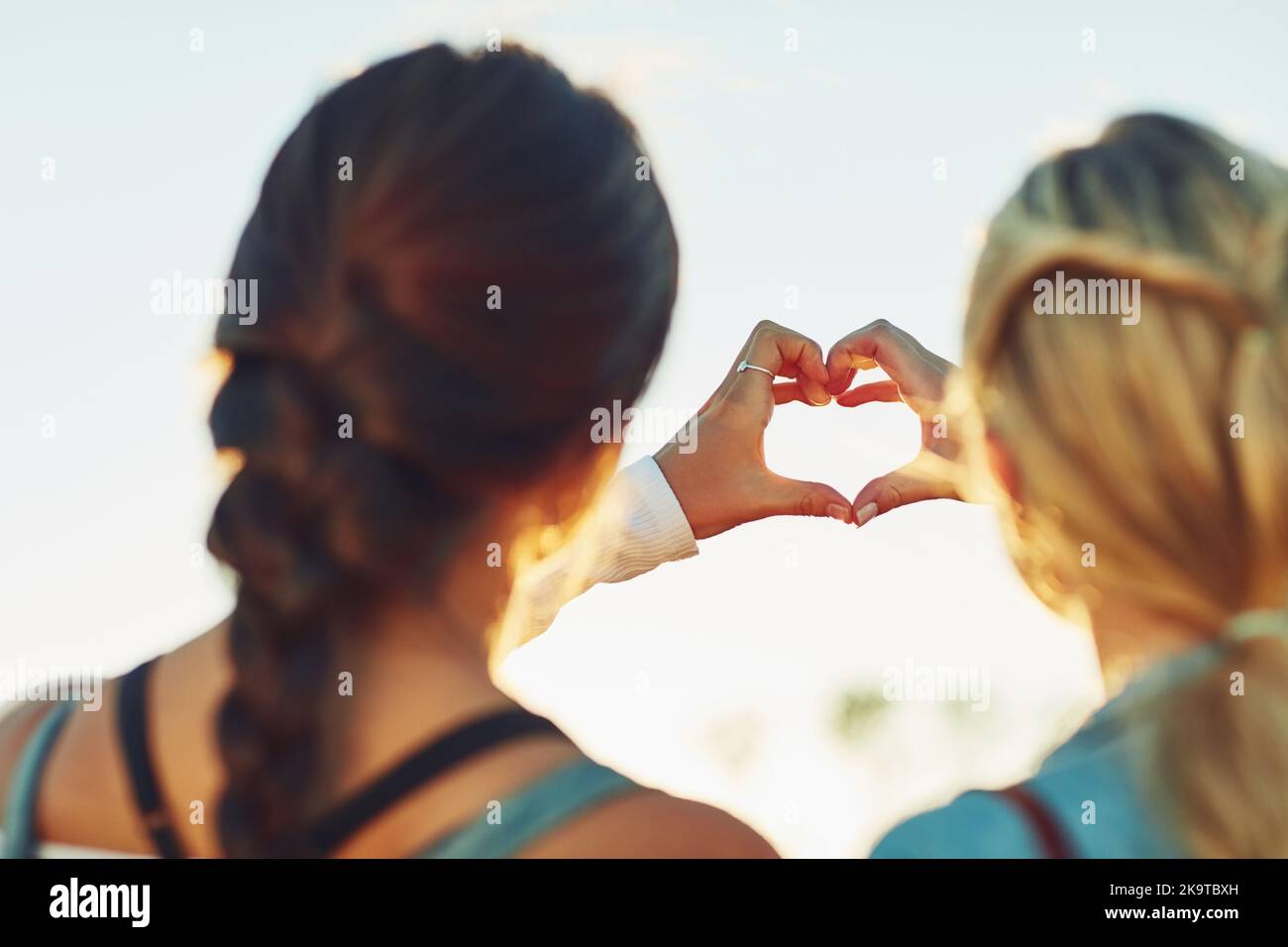 We both really love travelling. Rearview shot of two unrecognizable ...