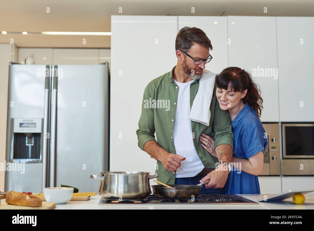 I cant wait to dig in to that. a mature couple cooking together at home ...