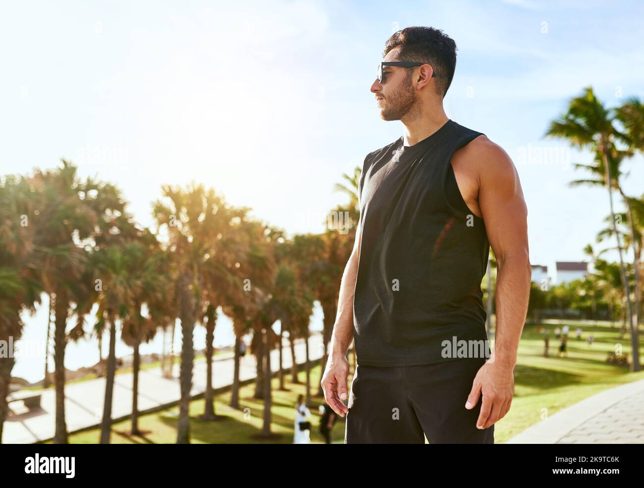 Now thats one fit and fine young man. a sporty young man standing ...