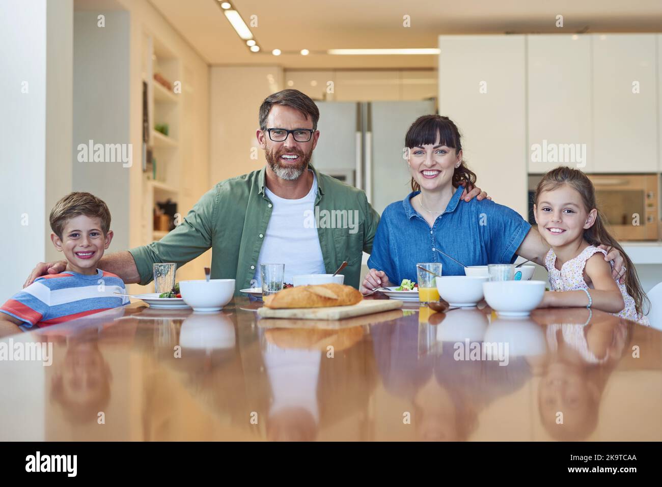 Every meal is enjoyed better with family all around. Portrait of a ...