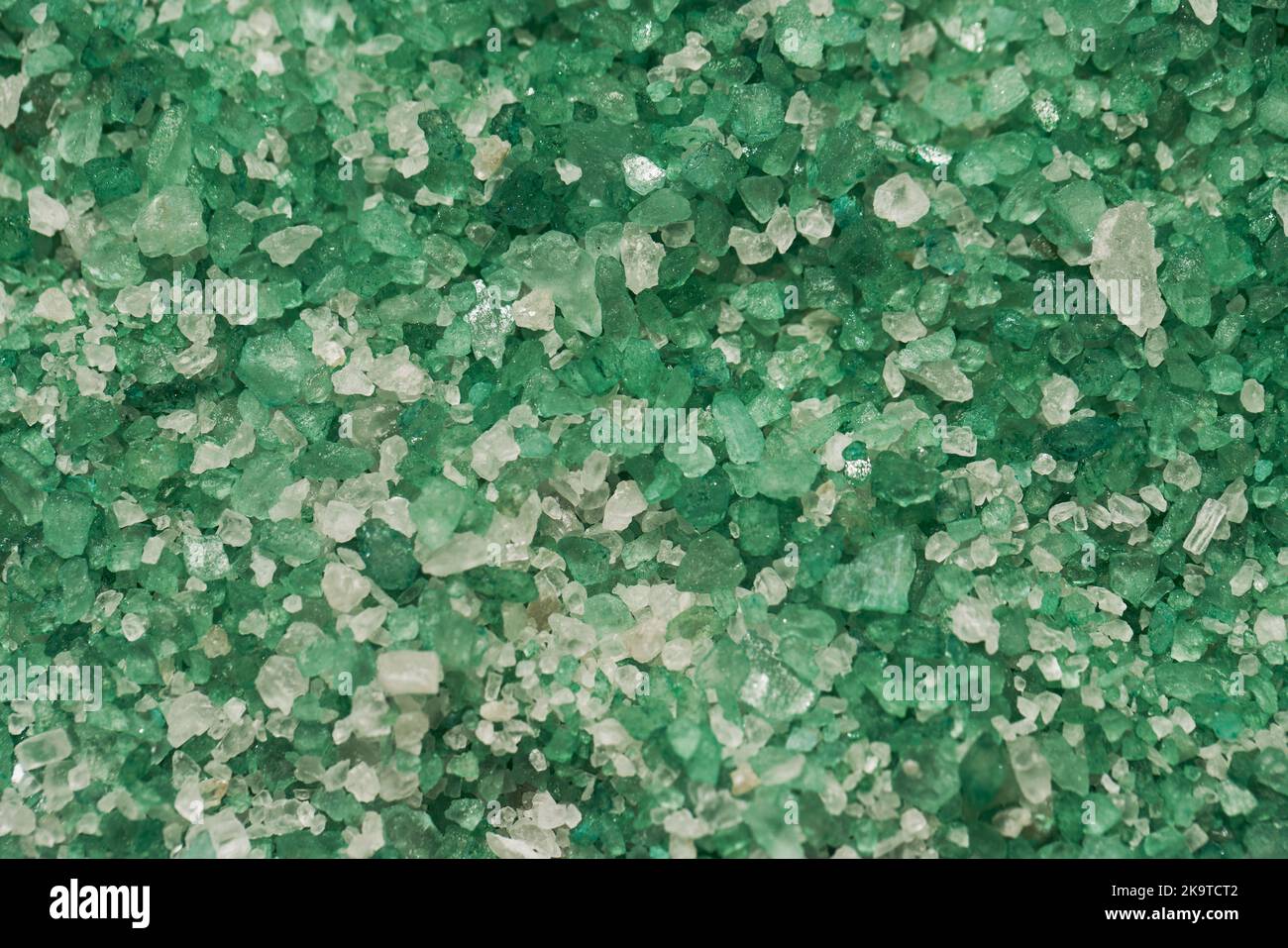 Texture of sea salt white and green color in close-up. Body treatment ...