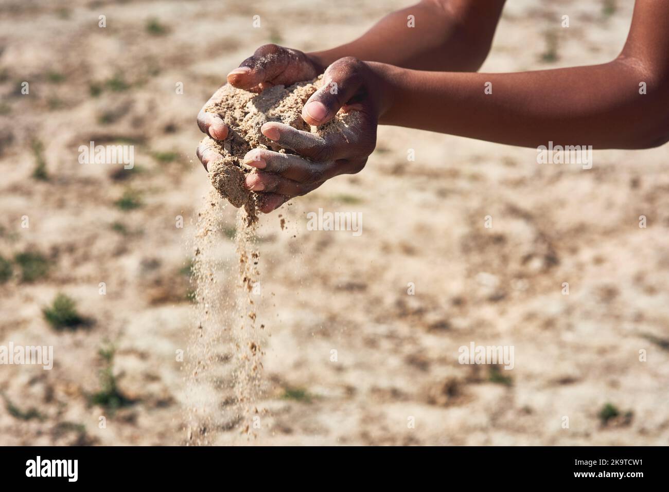 All the moisture has gone. an unrecognizable person holding two hands ...
