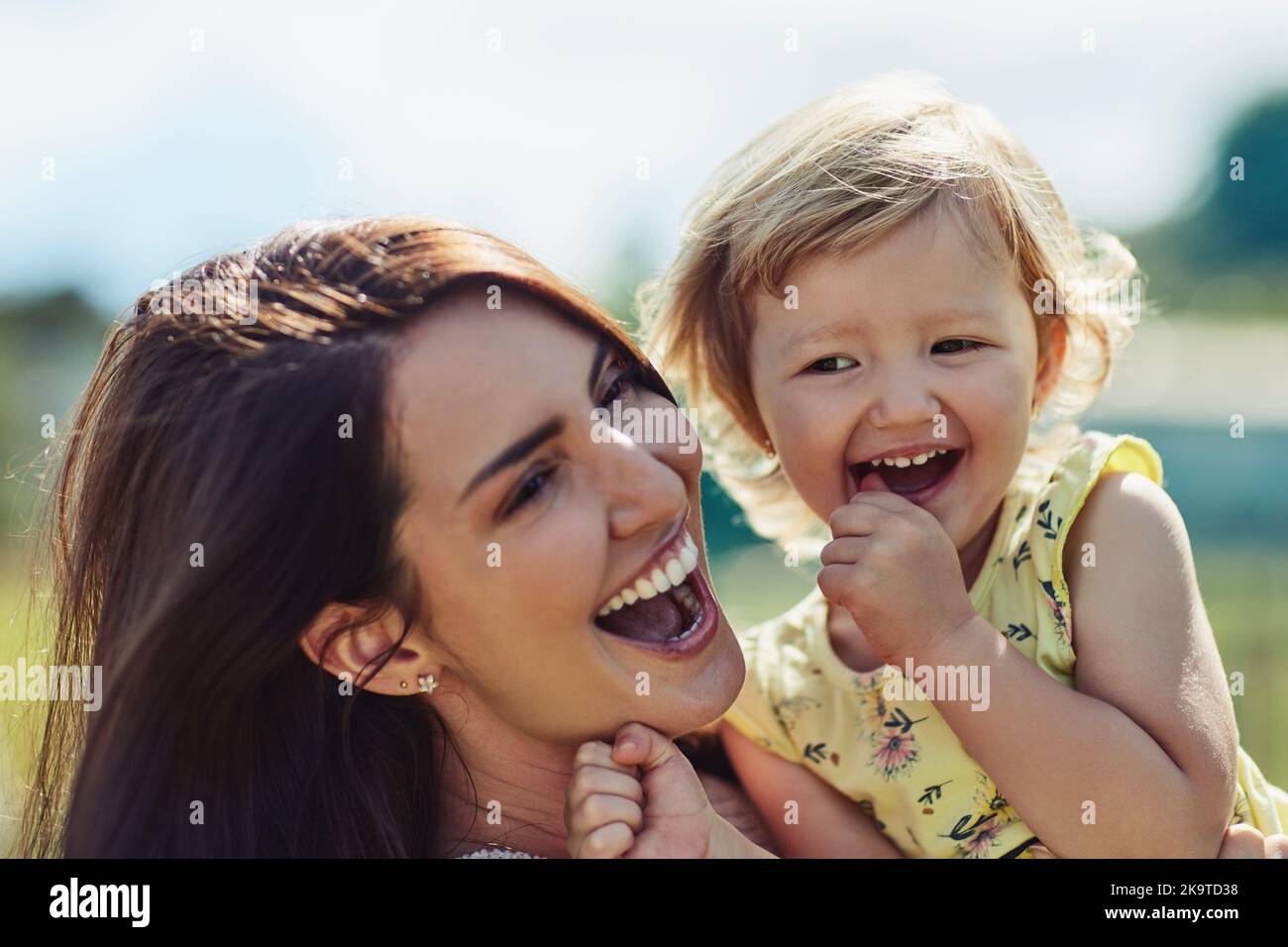 They share such a beautiful bond. a mother bonding with her little daughter outdoors Stock Photo ...