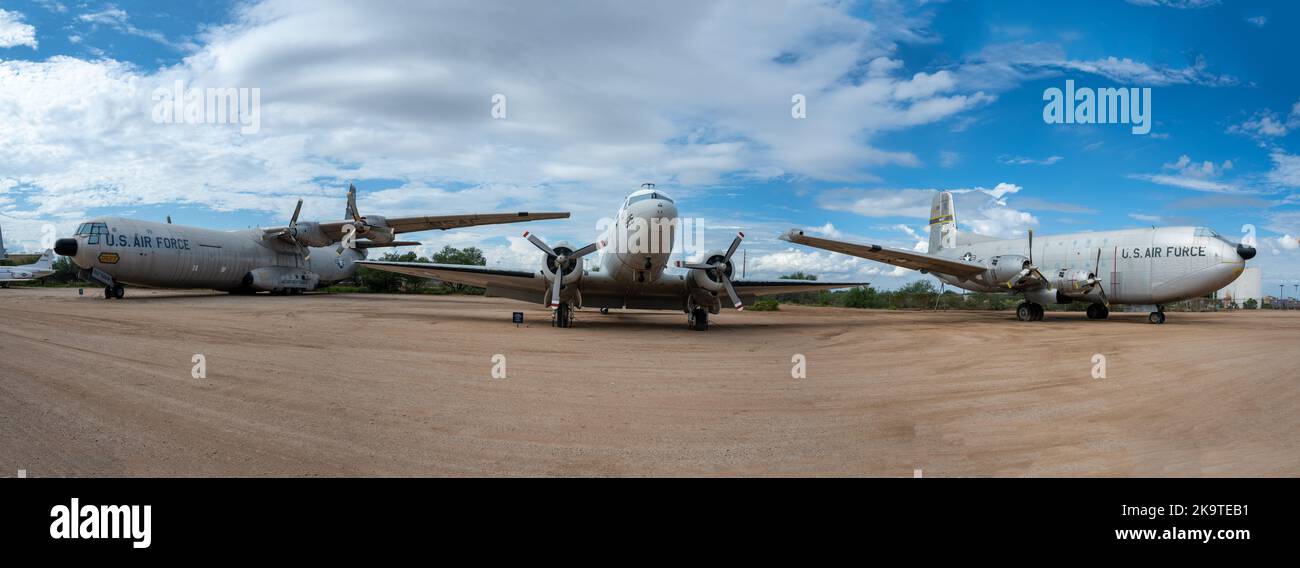 A panoramic view of three military cargo aircraft on display at the ...