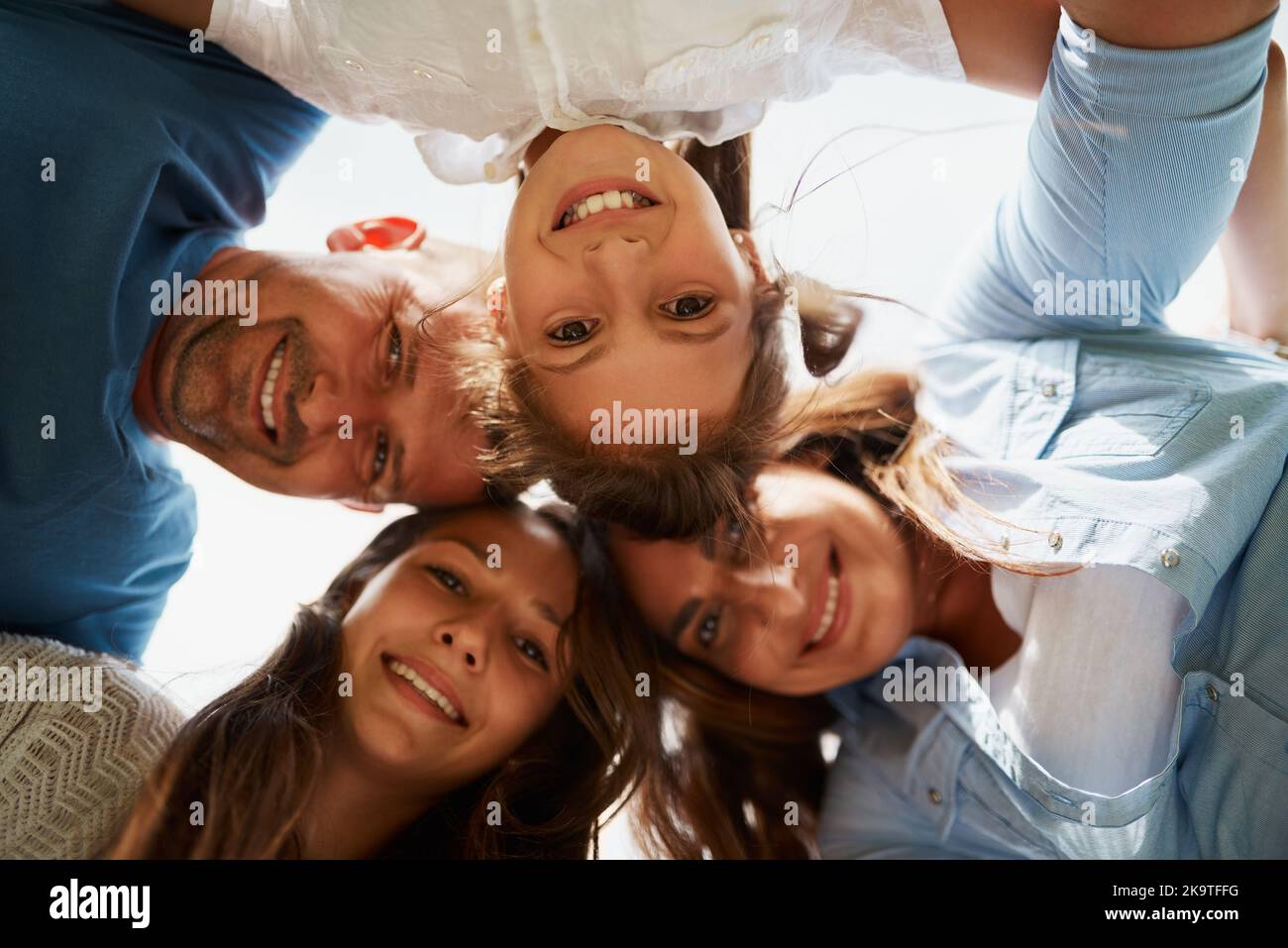 Family makes life fun. Low angle portrait of a young family of four ...