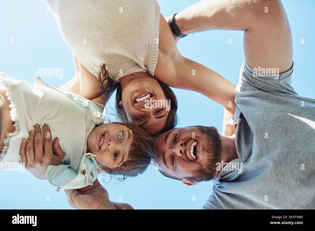 Love is what makes a family circle strong. Low angle portrait of a ...