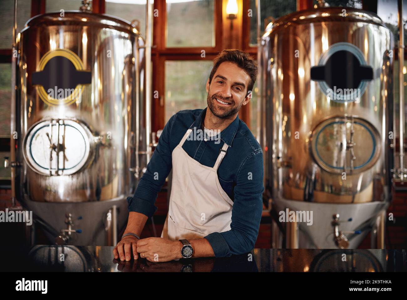 The best is only expected of us. Portrait of a cheerful young barman ...
